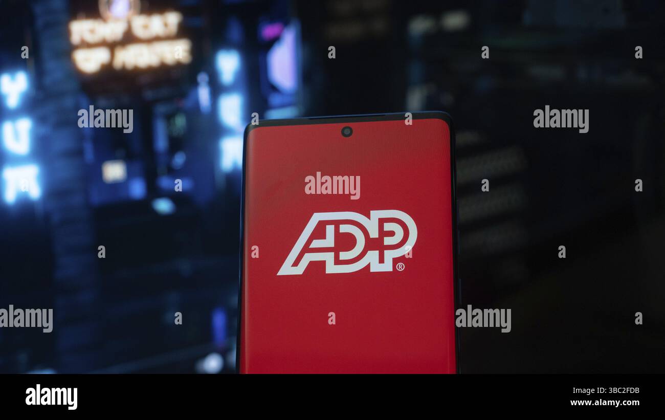 ADP logo displayed prominently in front of the companys dynamic stock ...