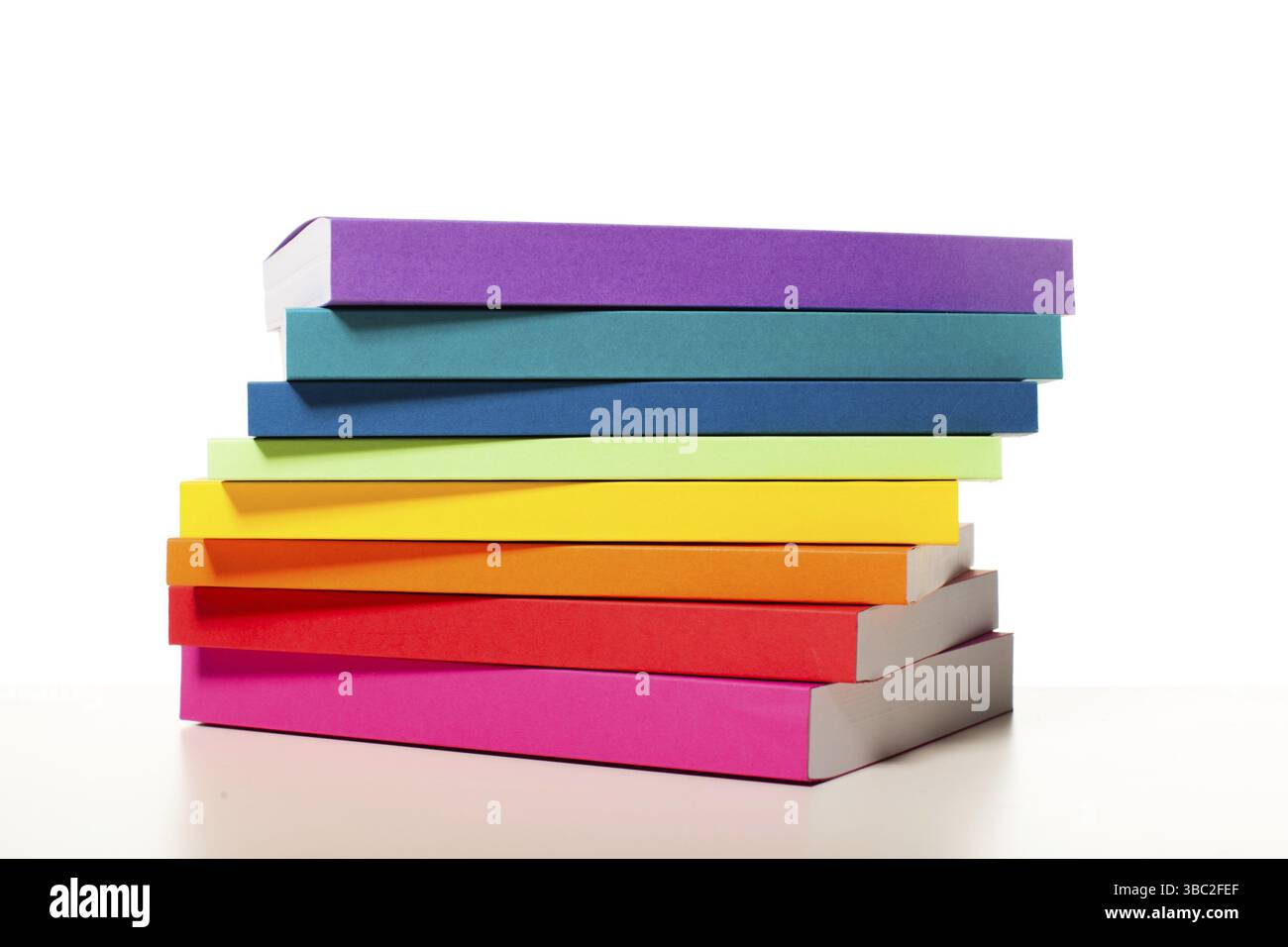 Colorful books are outlined in the colors of the rainbow. Stacked of ...