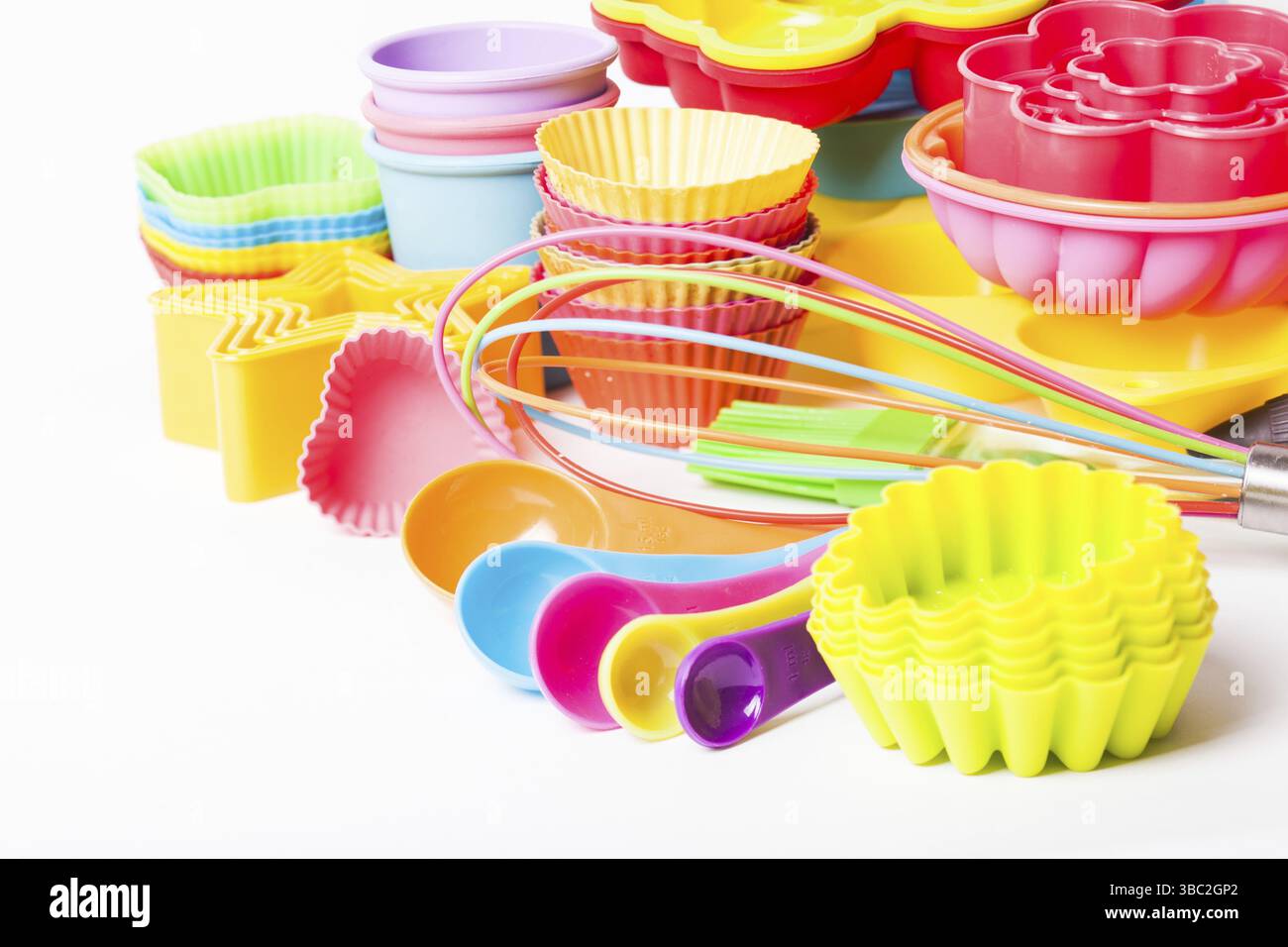 Rainbow silicone confectionery utensils on a white background Stock ...