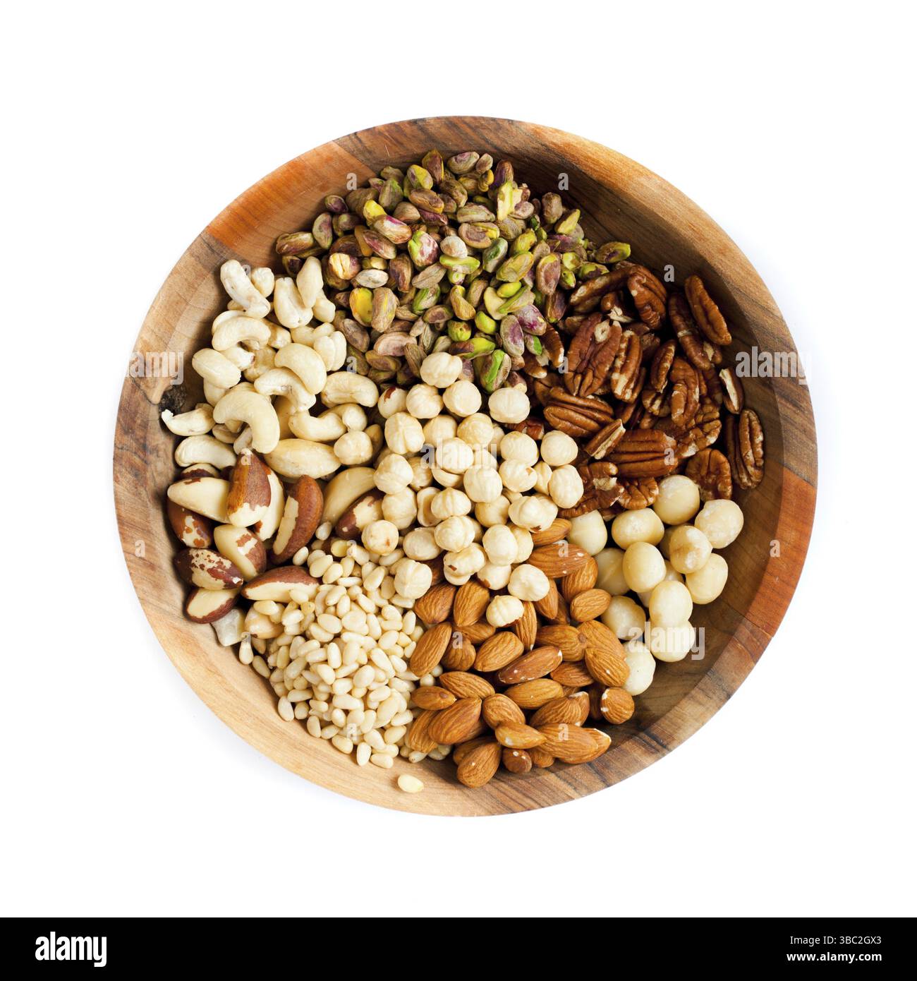 Top view of wooden plate with vasious types of nuts isolated on white ...
