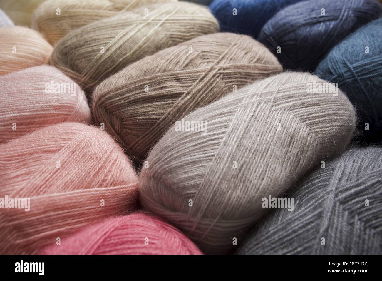 Closeup of skeins of threads that are tightly folded together. The ...