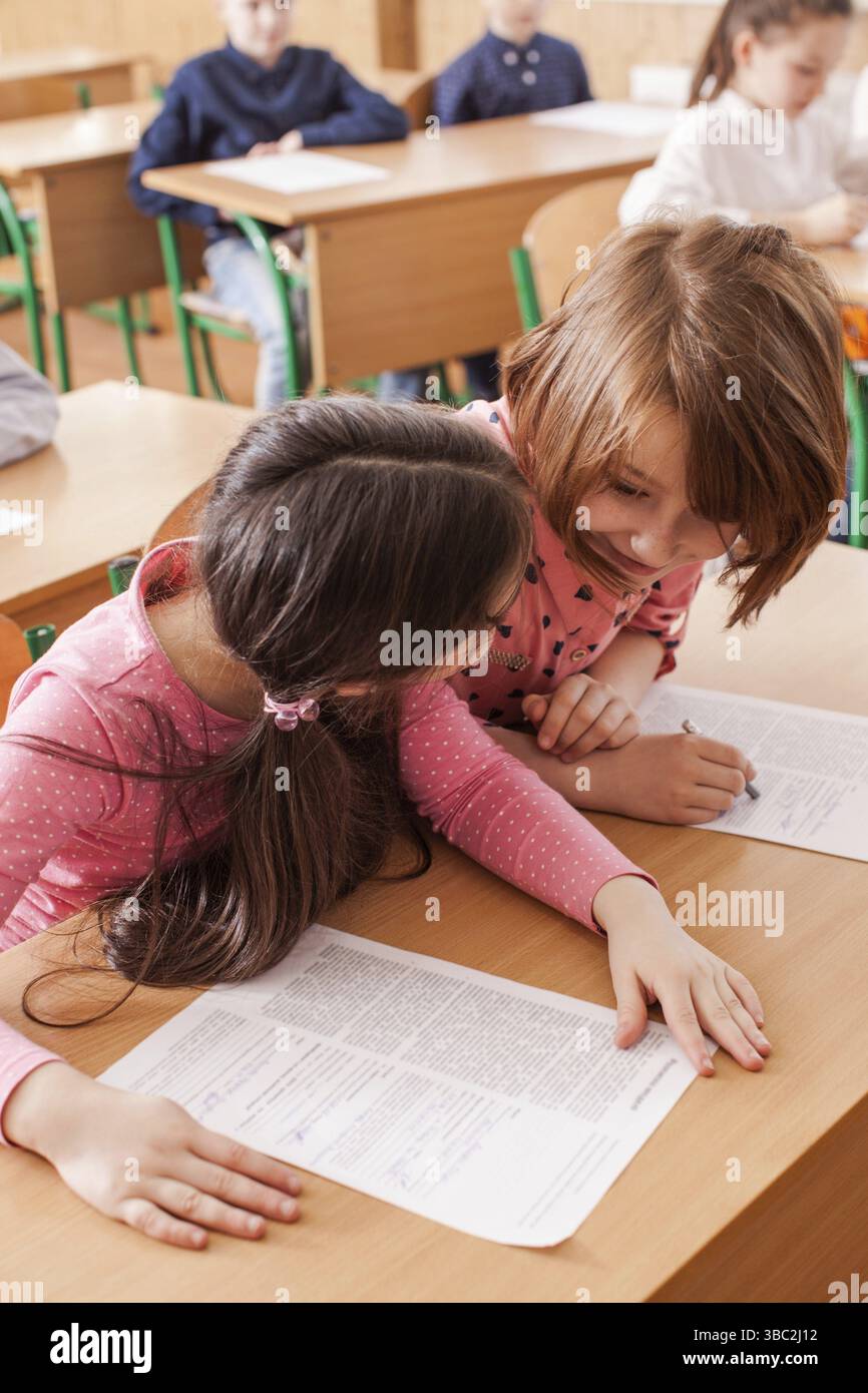 Children of primary school taking an exam writing school test Stock ...