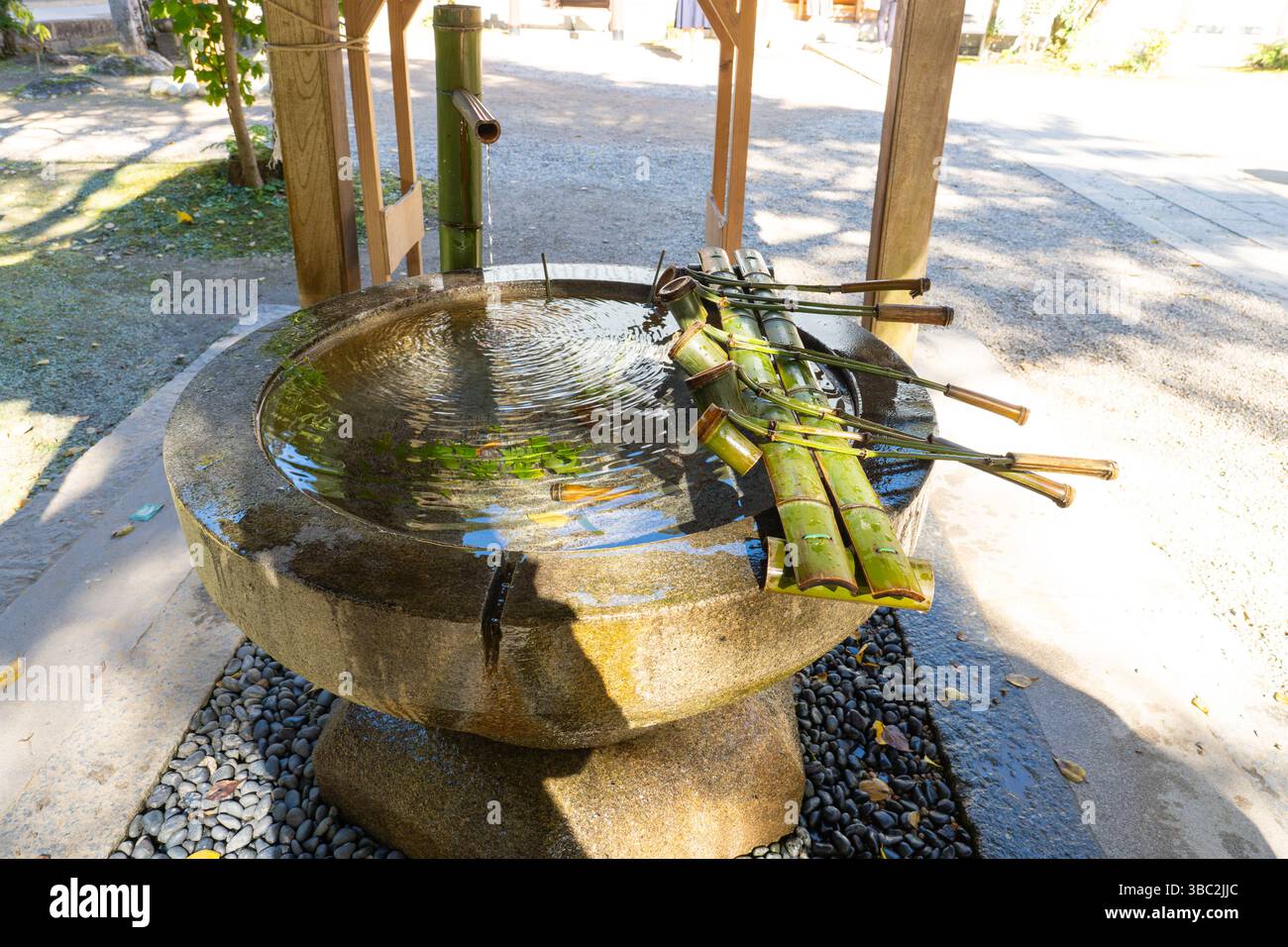 Traditional Japanese ritual washing hands sink station with bamboo ...