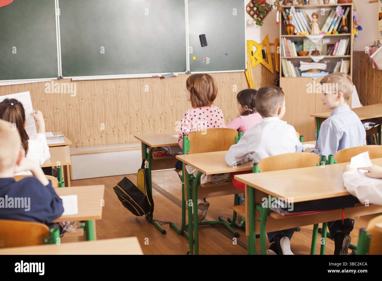 Children of primary school taking an exam writing school test Stock ...