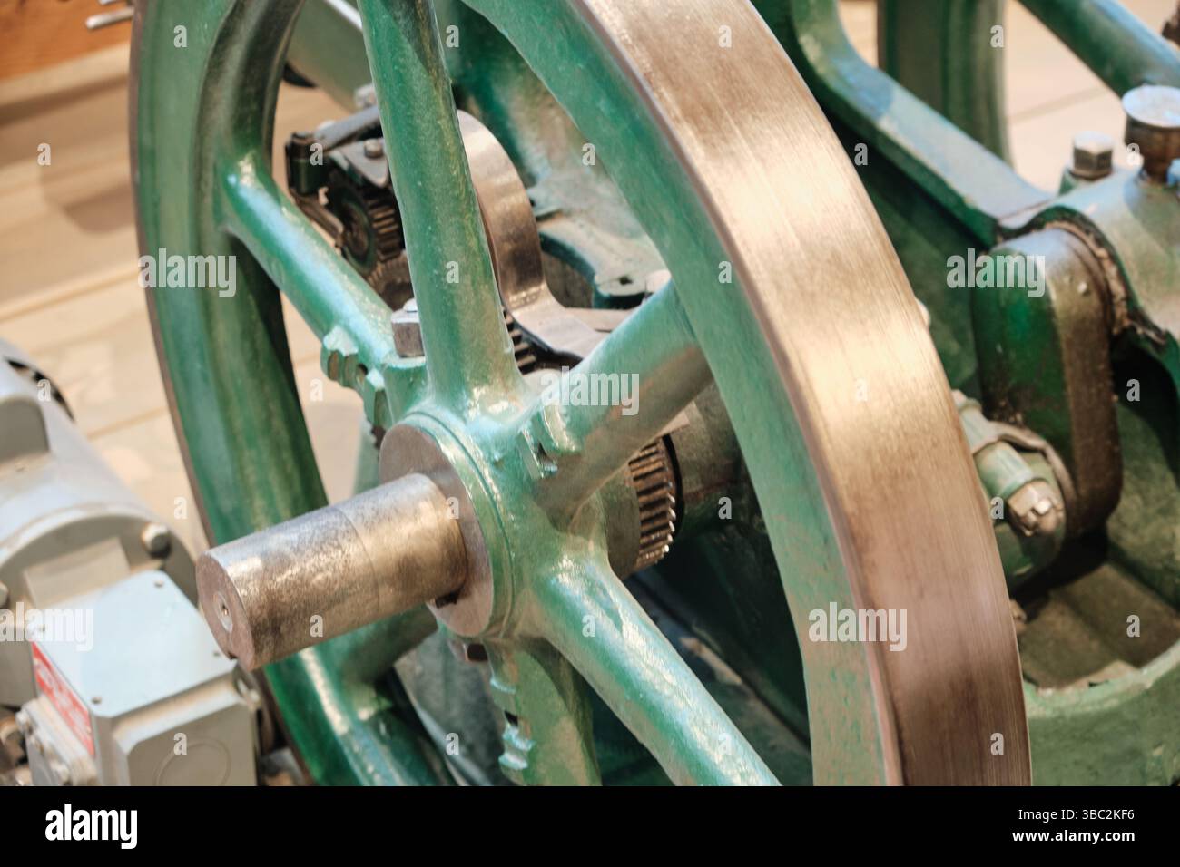 A close-up of the flywheel of an industrial steam engine Stock Photo ...