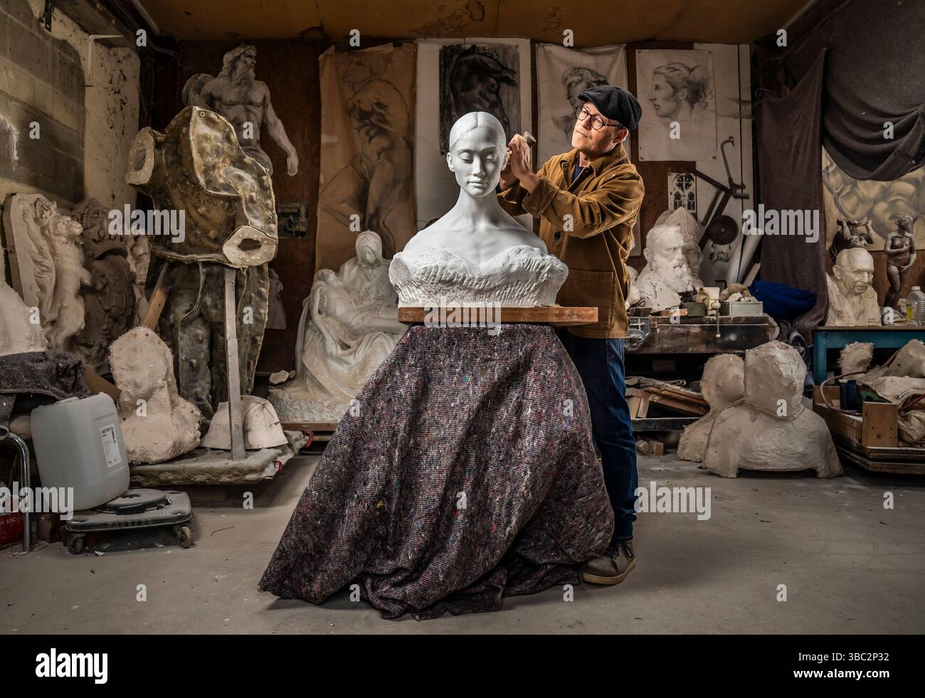 Award-winning figurative sculptor Andrian Melka works on a marble ...