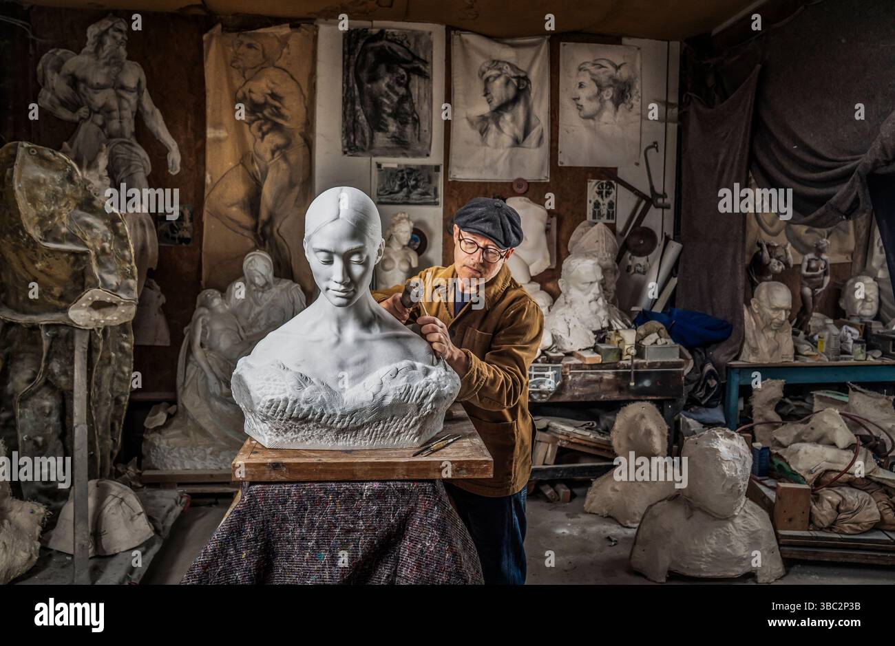 Award-winning figurative sculptor Andrian Melka works on a marble ...