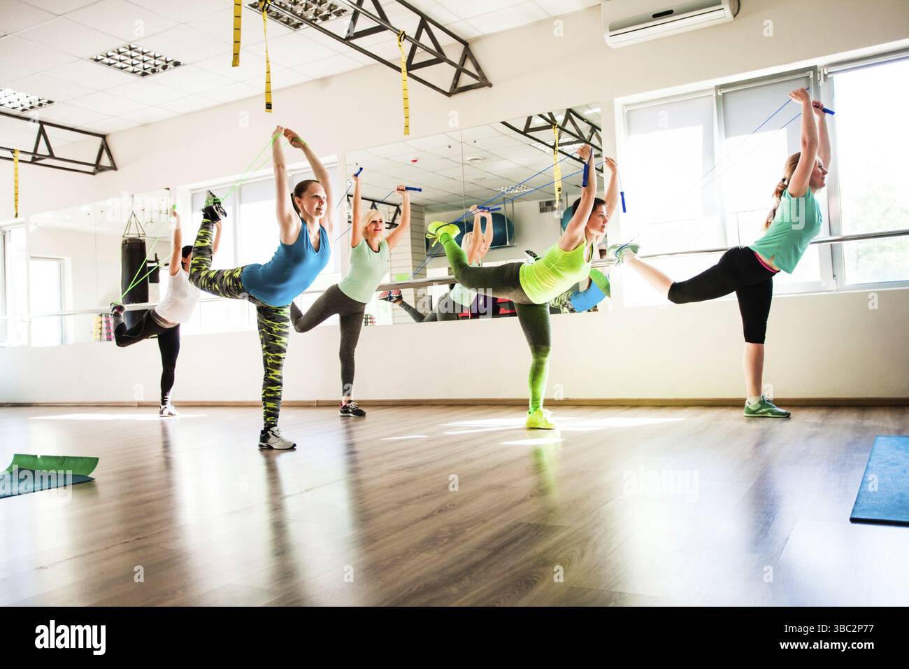Group of fitness women trains with jump rope at the gym Stock Photo - Alamy