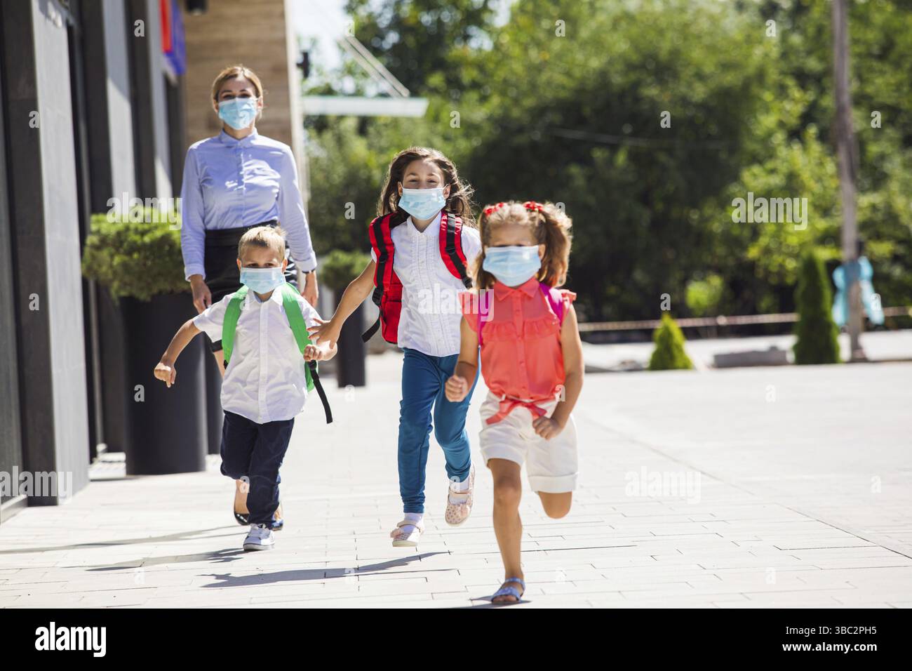 Running schoolboy in mask hi-res stock photography and images - Alamy