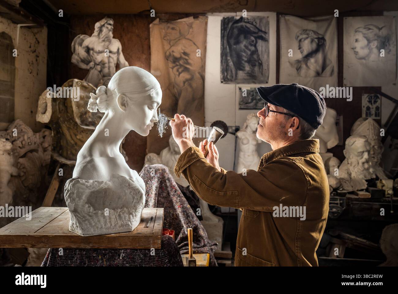 Award-winning figurative sculptor Andrian Melka works on a marble ...