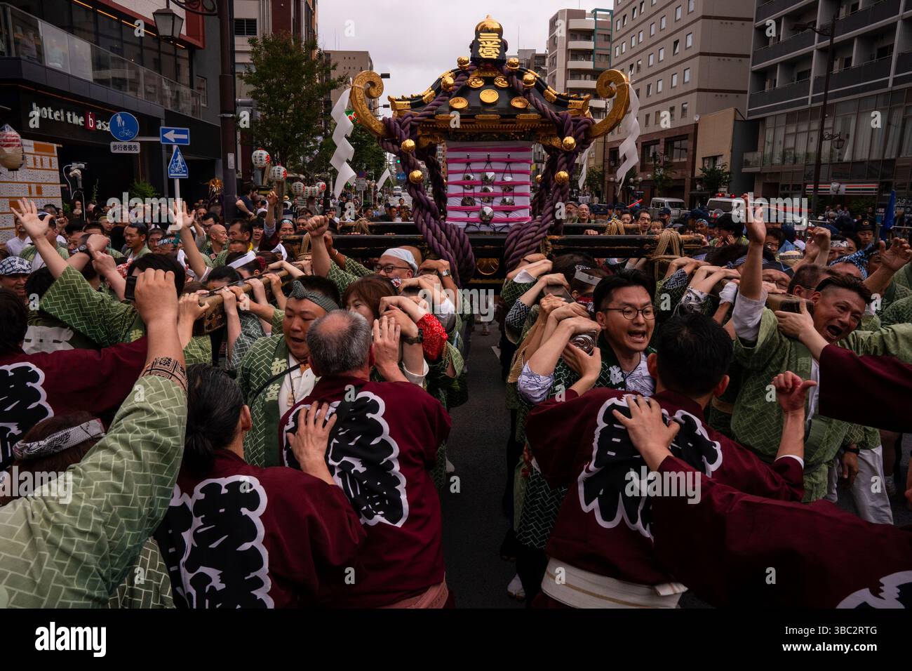 Participants carry a mikoshi, or portable shrine, near the Asakusa ...