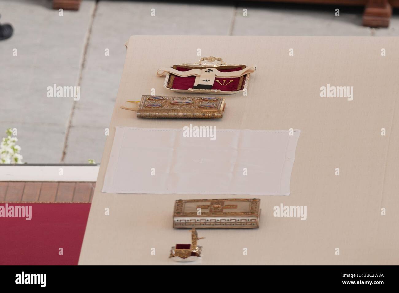 The pallium, or lambswool stole, center, and the fisherman's ring ...