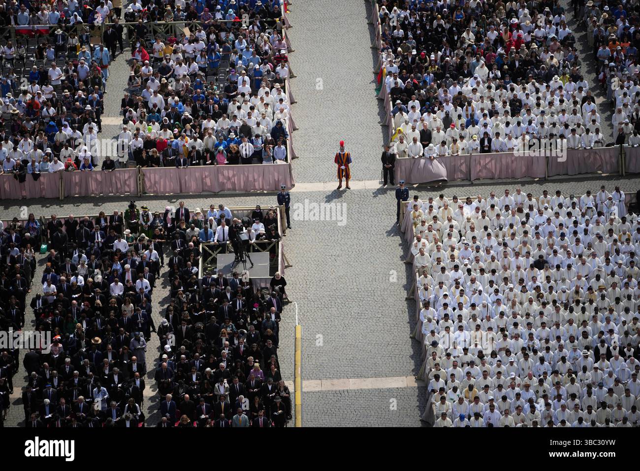 People gather as Pope Leo XIV celebrates a Mass for the formal ...