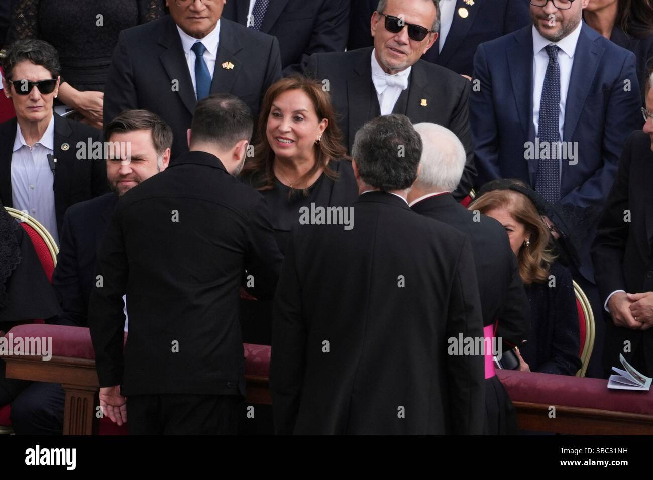 Ukraine's President Volodymr Zelenskyy, center, is greeted by Peru's ...