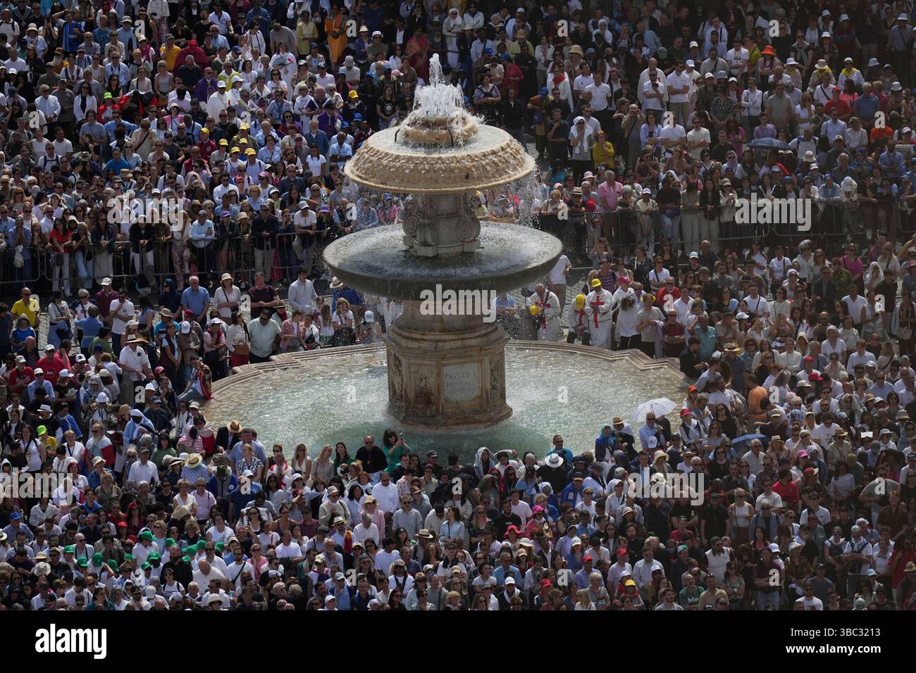 People gather as Pope Leo XIV celebrates a Mass for the formal ...
