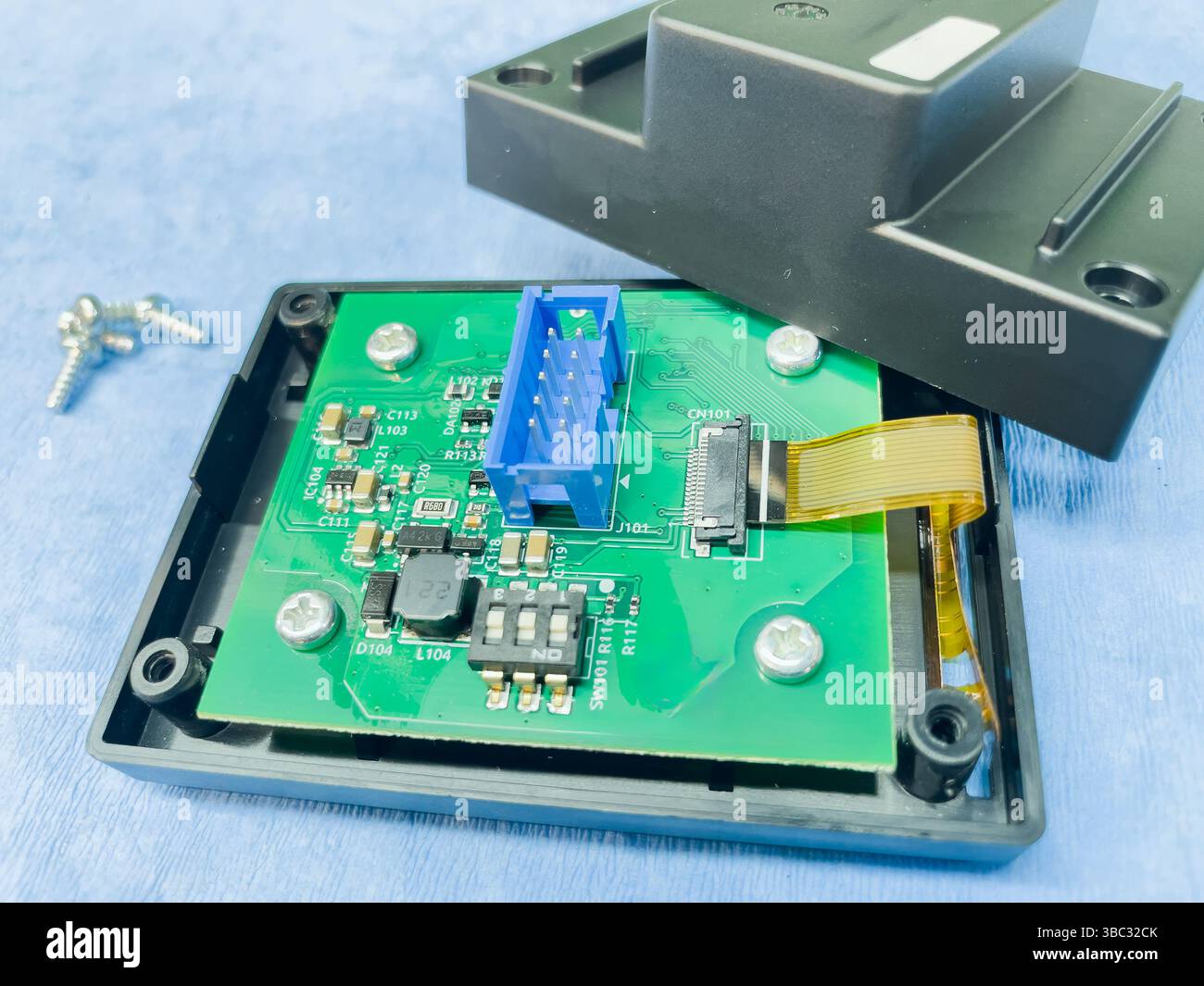 Disassembled electronic device exposing its internal components ...