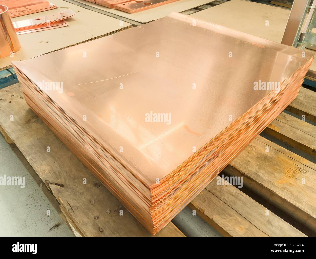 Copper sheets are stacked and ready for processing in a metalworking ...