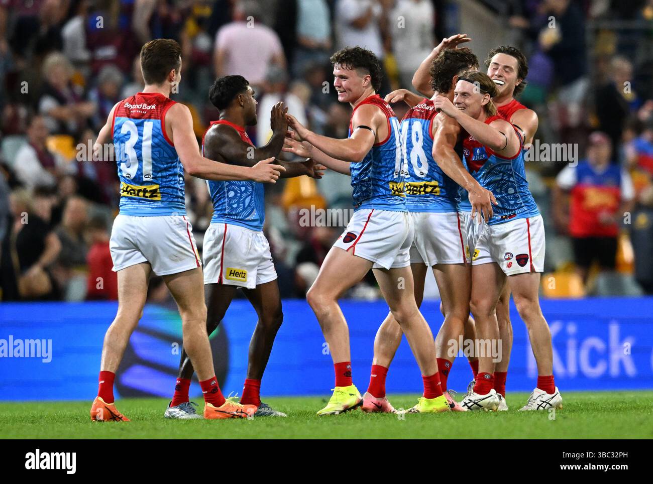 Brisbane, Australia. 18th May, 2025. Demons players celebrate winning ...