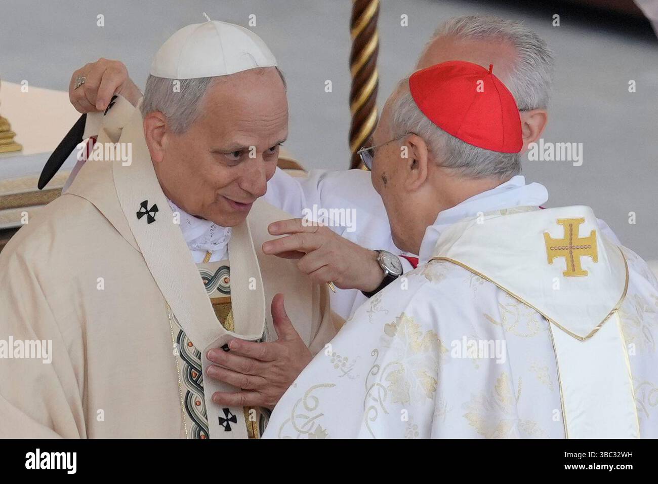 Pope Leo XIV receives the pallium, or lambswool stole, a symbol of the ...