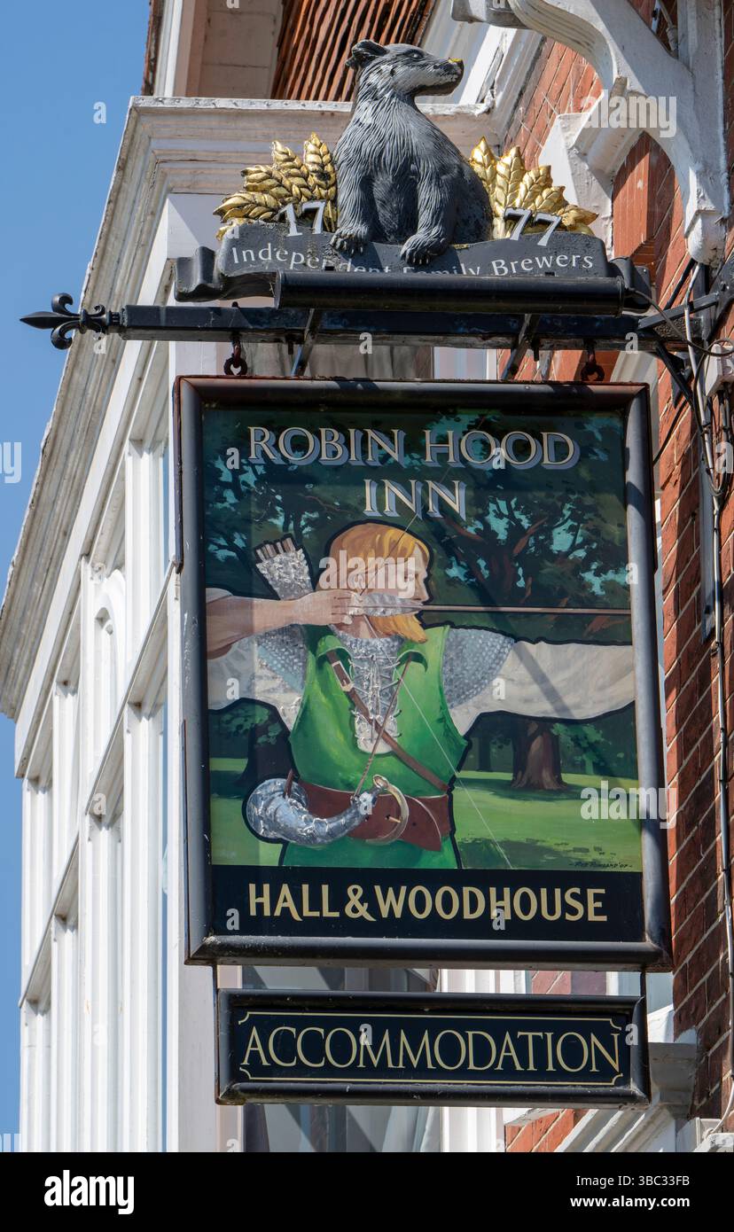 Traditional hanging pub sign at The Robin Hood Inn - Hall & Woodhouse ...