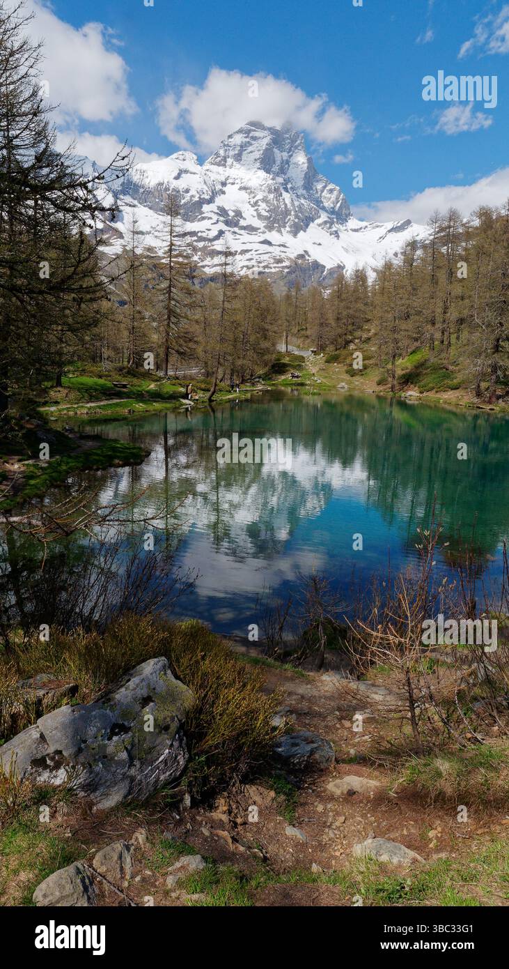 Shore of Lake Blue (Lago Blu) and the snow capped Cervino (aka ...