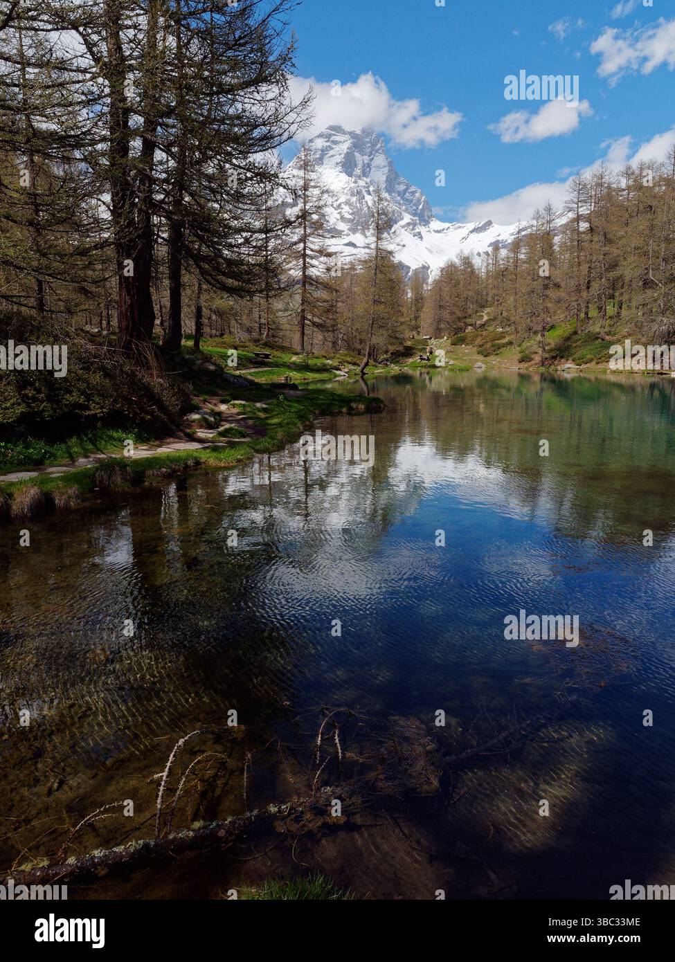 Shore of Lake Blue (Lago Blu) and the snow capped Cervino (aka ...