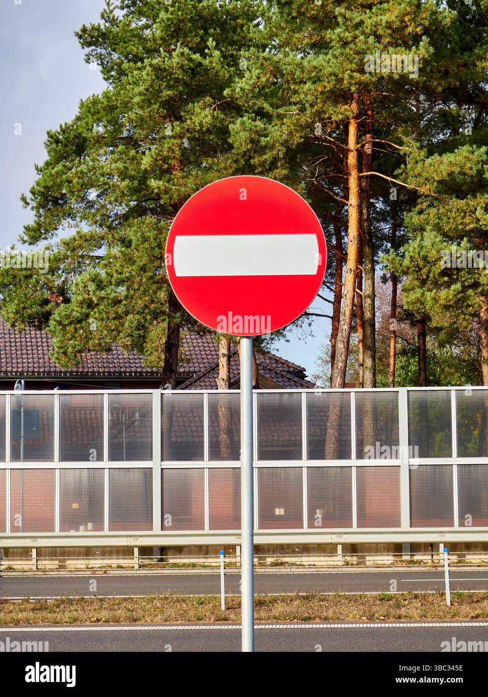 No Entry Road Sign Against Sound Barrier and Trees Stock Photo - Alamy