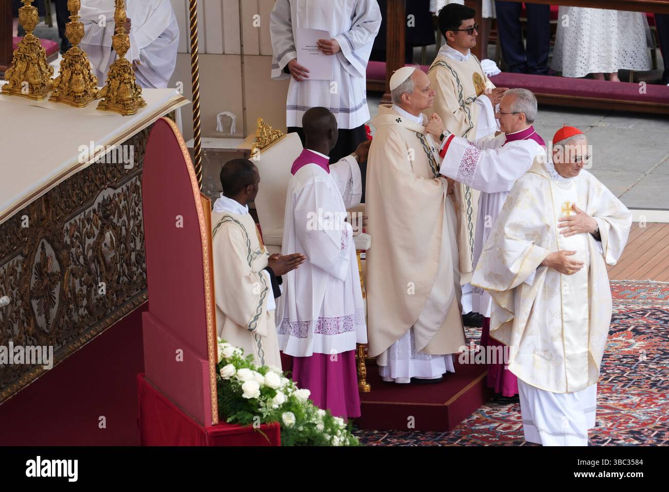 Pope Leo XIV has the pallium adjusted, or lambswool stole, a symbol of ...