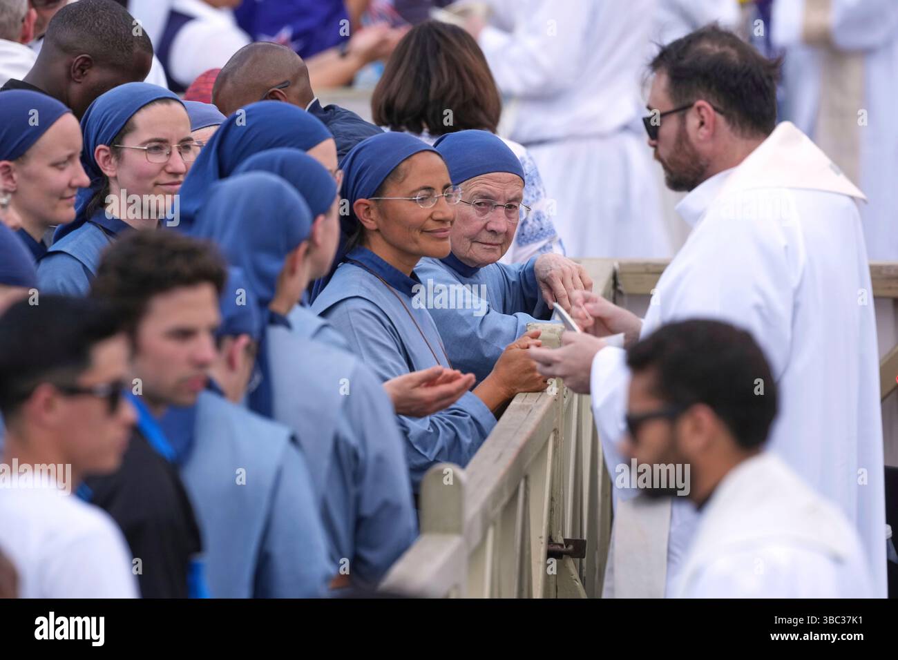 Nuns receive the communion as Pope Leo XIV celebrates a Mass for the ...