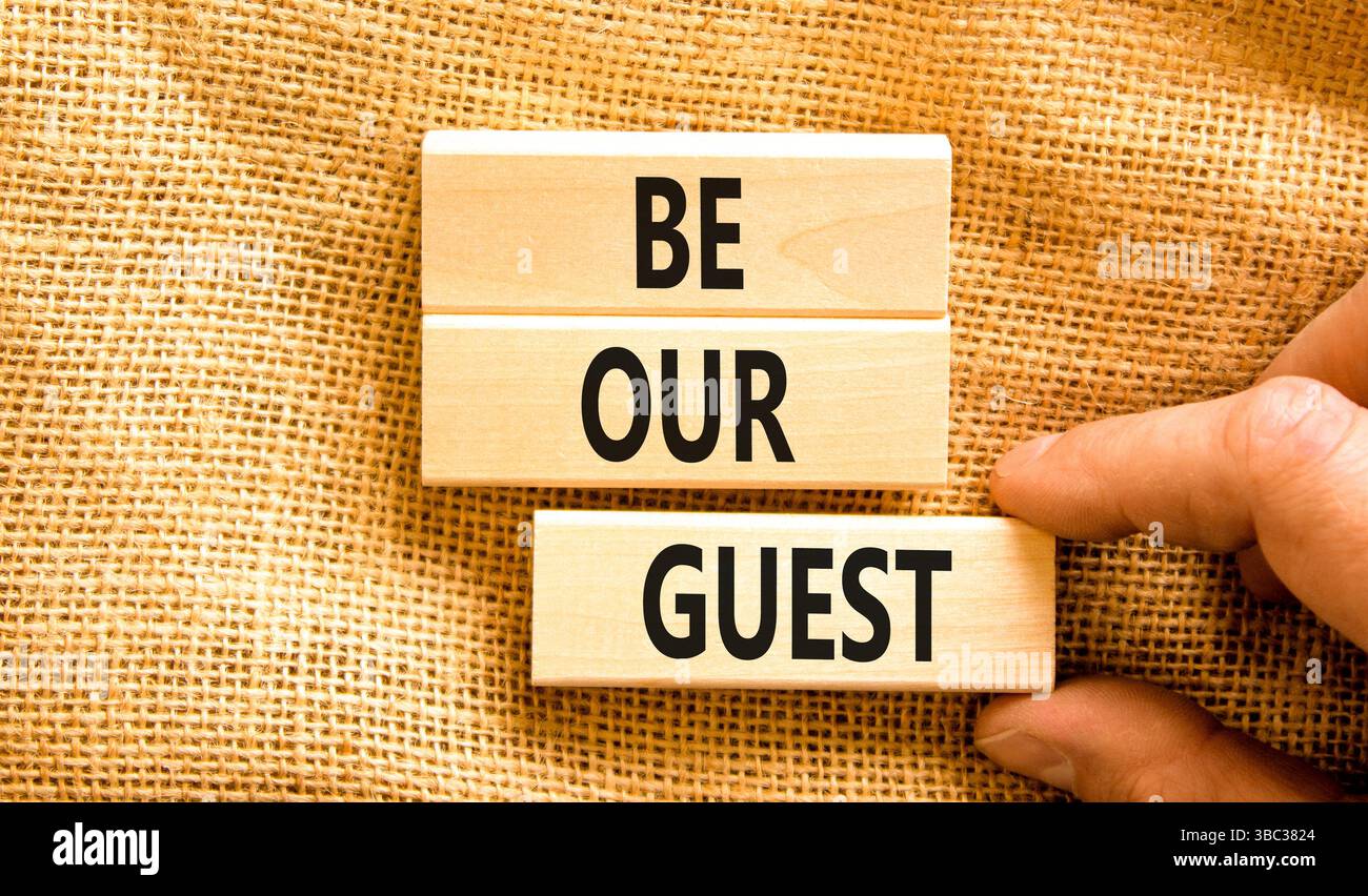 Be our guest symbol. Concept words Be our guest on beautiful wooden ...