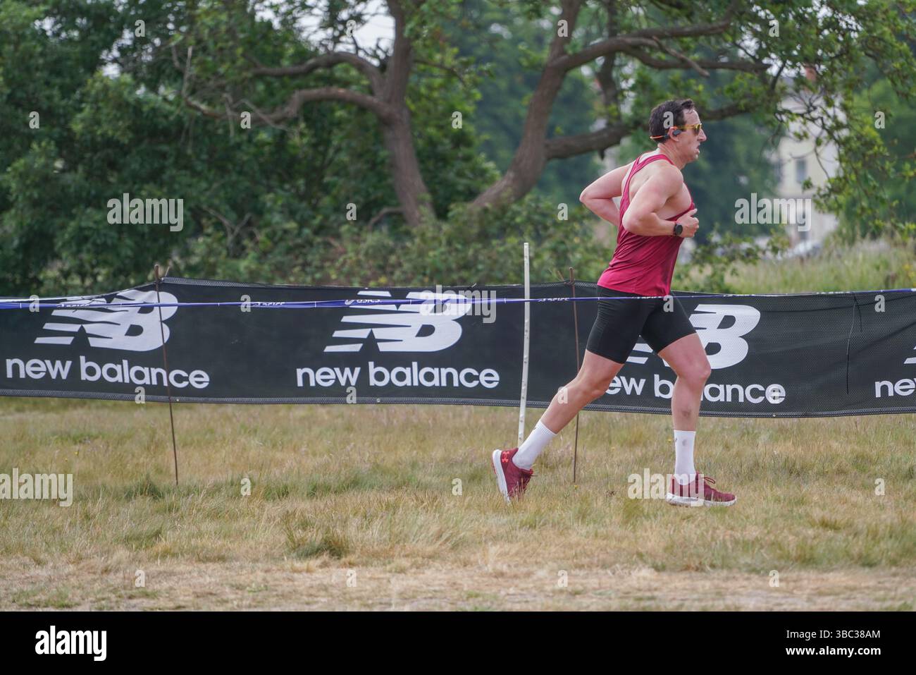 London, UK. 18 May 2025. A participant takes part in the Wimbledon 10K ...