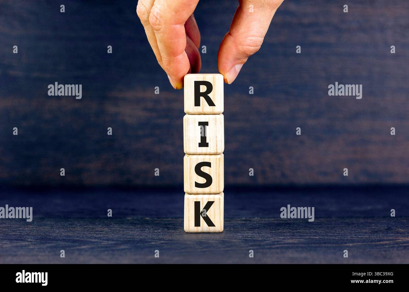 Risk symbol. Concept word Risk on beautiful wooden blocks. Businessman ...