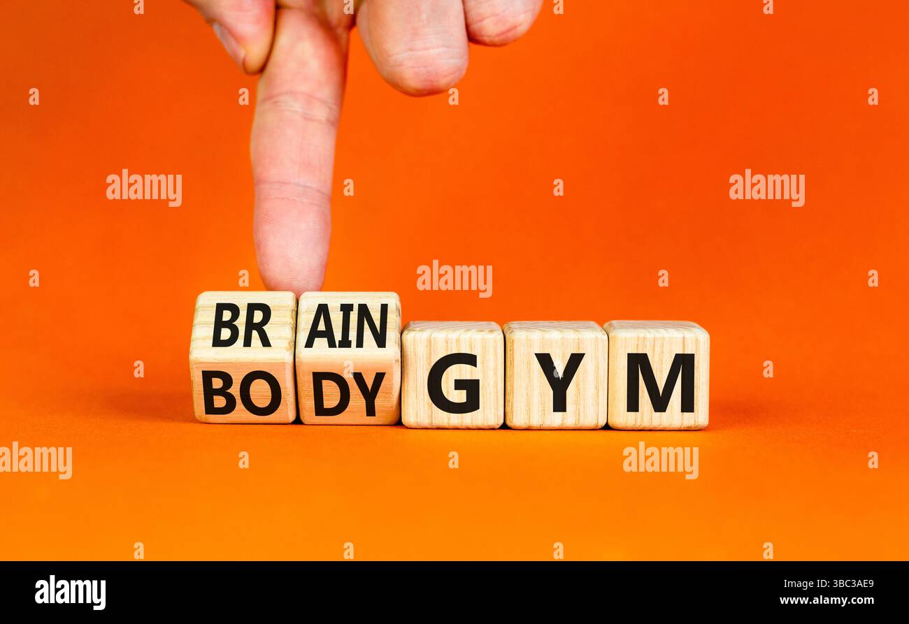 Body vs brain gym symbol. Businessman turns wooden cubes and changes ...