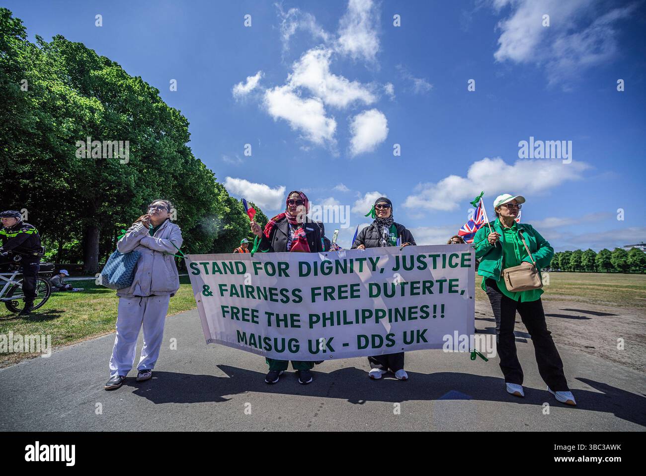 Protesters hold a banner during the demonstration. ‘FREEDOM MARCH ...