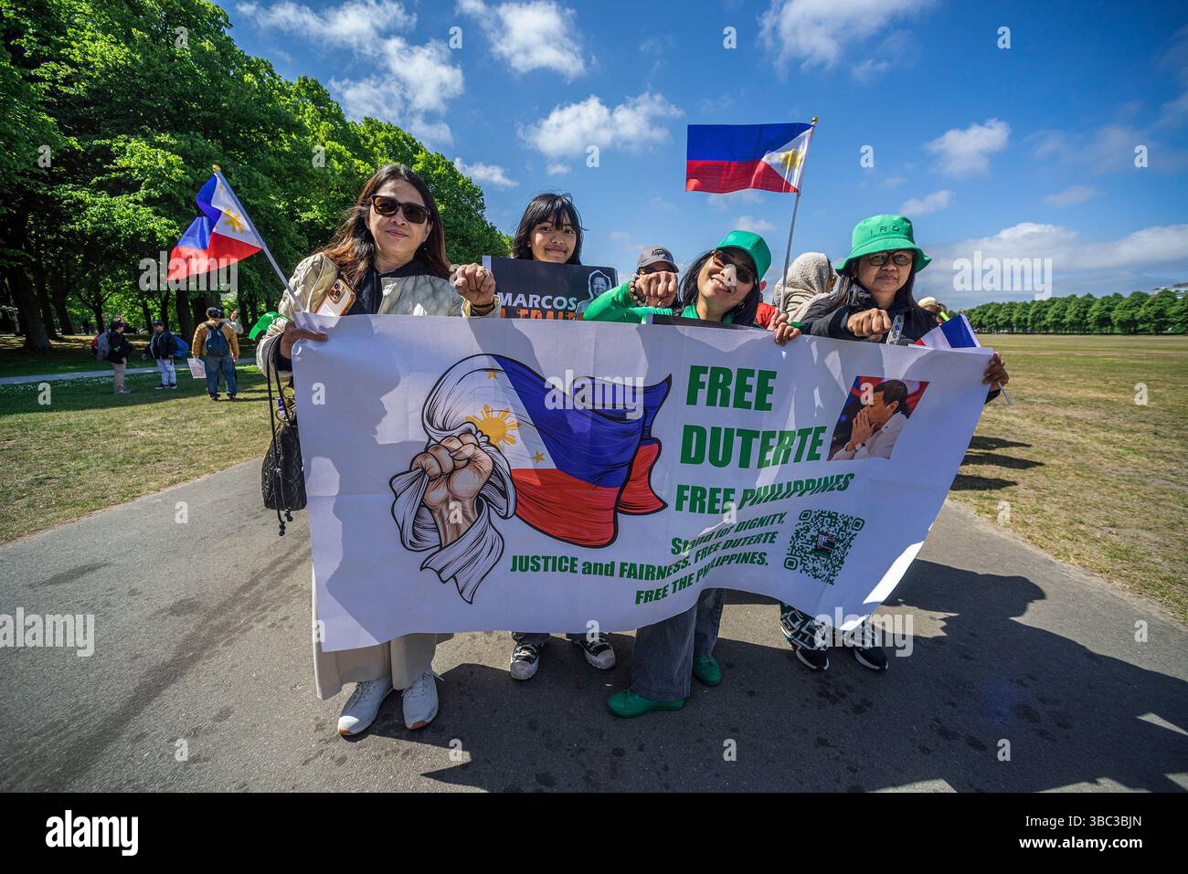 Protesters hold a banner during the demonstration. ‘FREEDOM MARCH ...