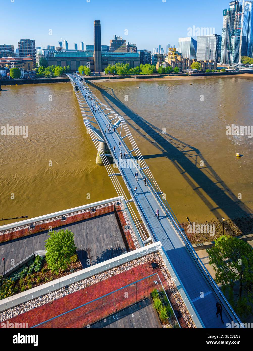 Aerial view of the Millennium Bridge crossing the River Thames toward ...
