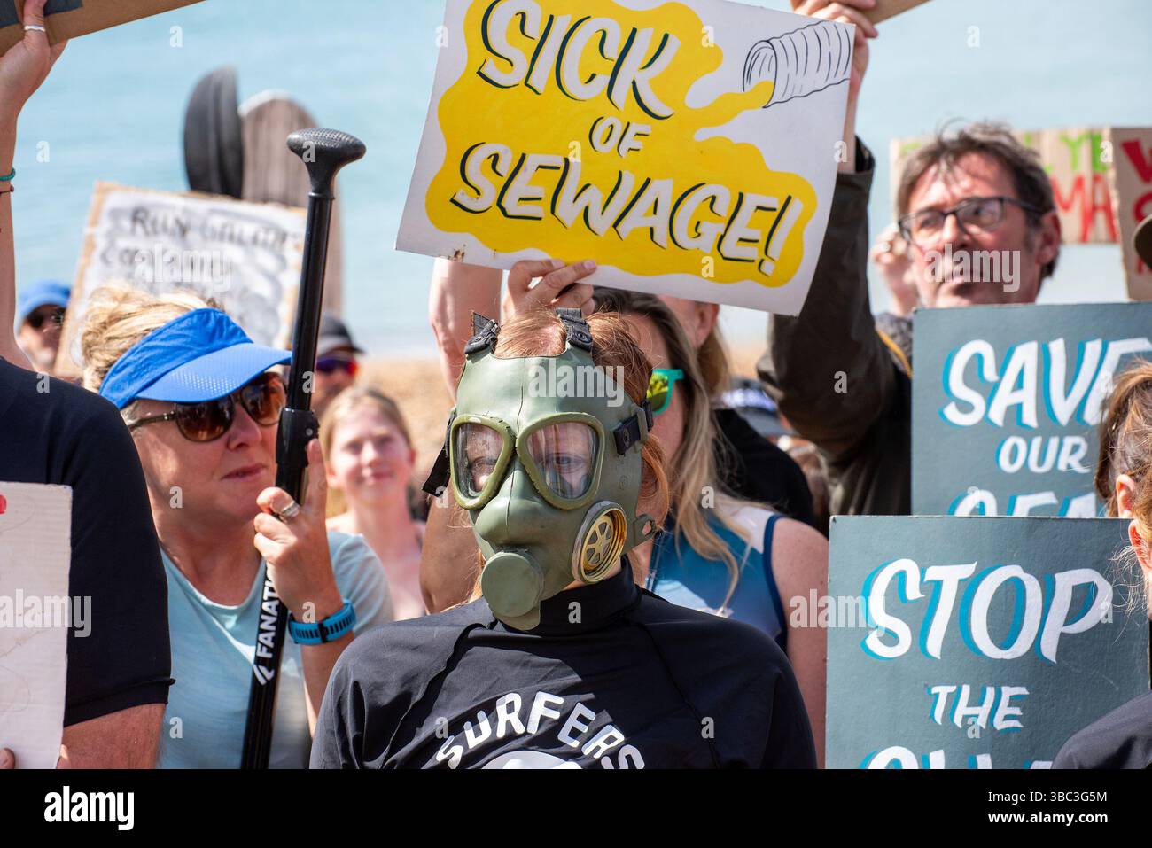 Brighton, UK. 17th May, 2025. A protester wears a gas mask during the ...