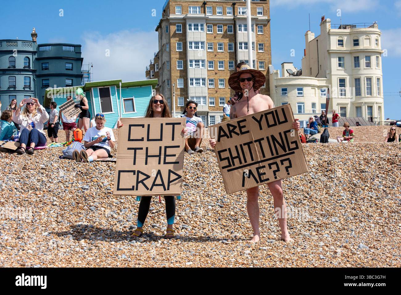 Brighton, UK. 17th May, 2025. A couple seen holding placards expressing ...
