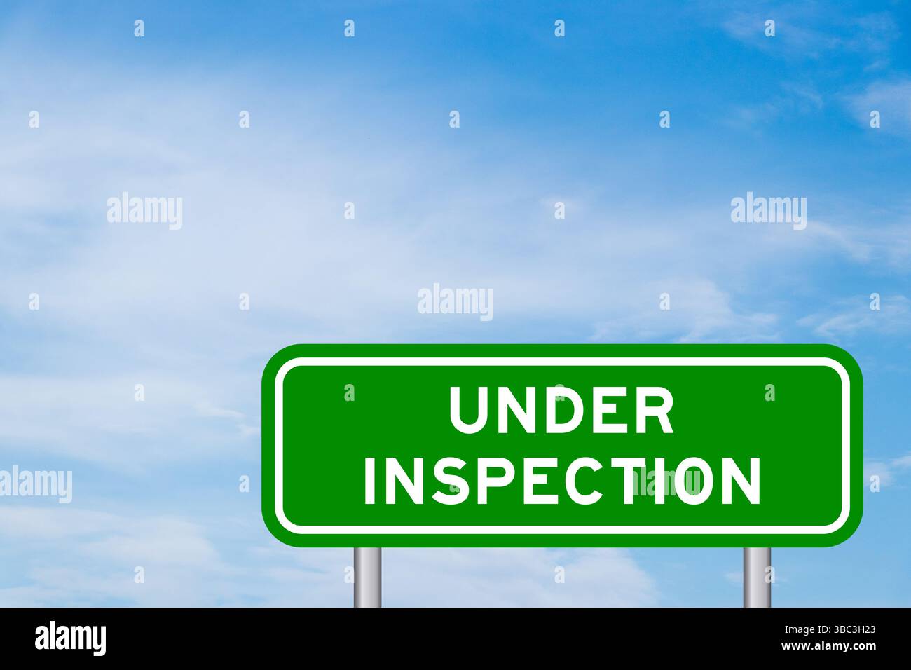 Green color transportation sign with word under inspection on blue sky ...