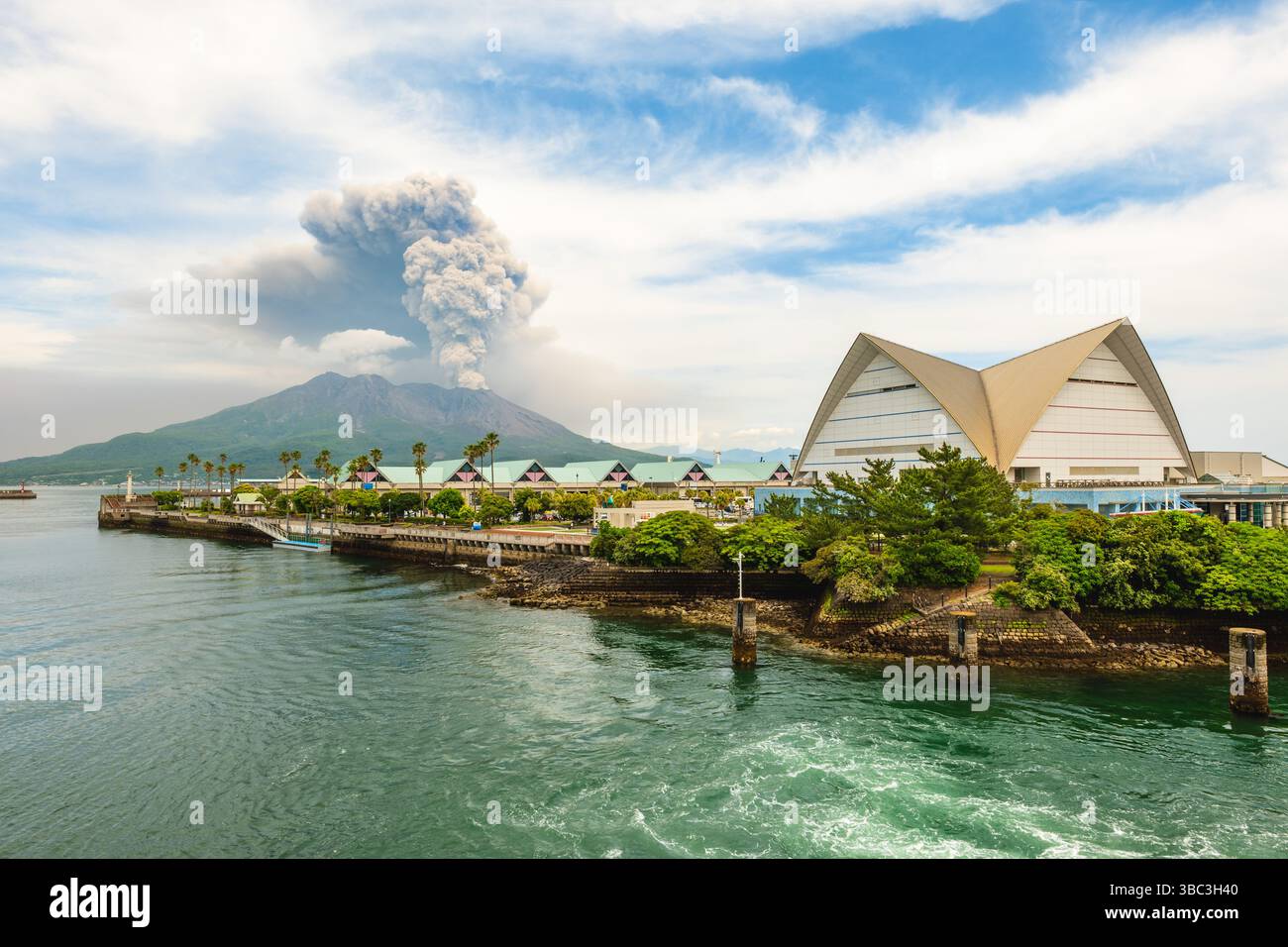 Kagoshima Aquarium and Sakurajima erupting in Kagoshima City, Kyushu ...