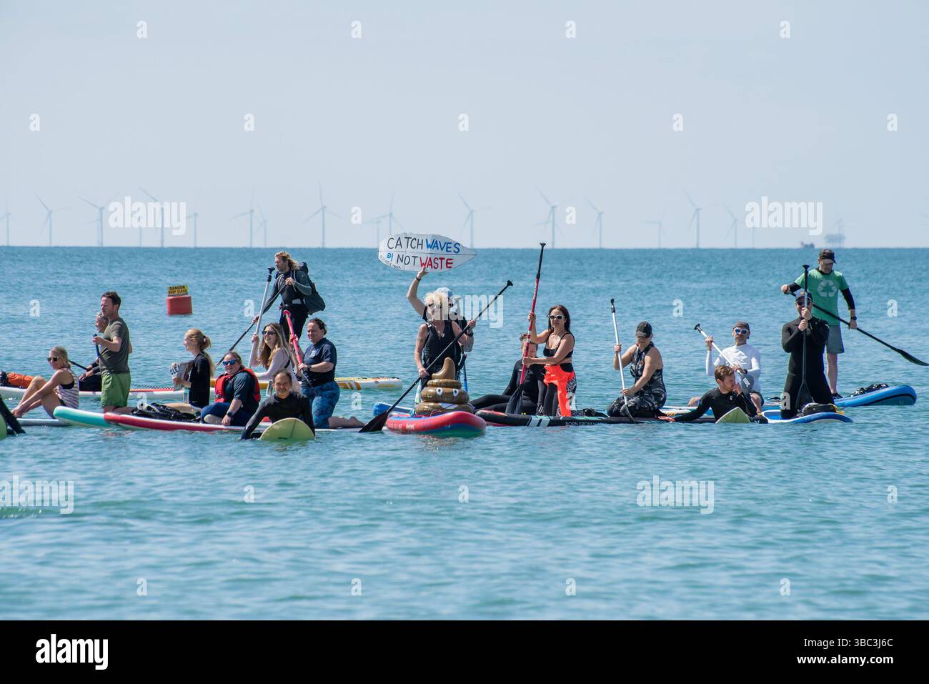 Brighton, UK. 17th May, 2025. Protesters paddle back from the open sea ...