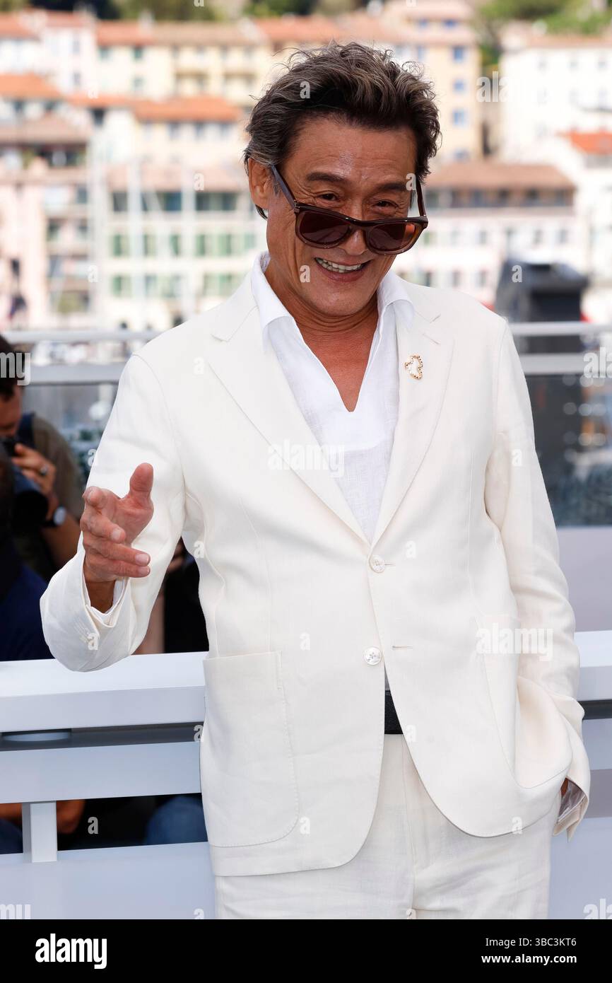 Tony Leung Ka-fai poses at the photocall of 'Sons Of The Neon Night ...