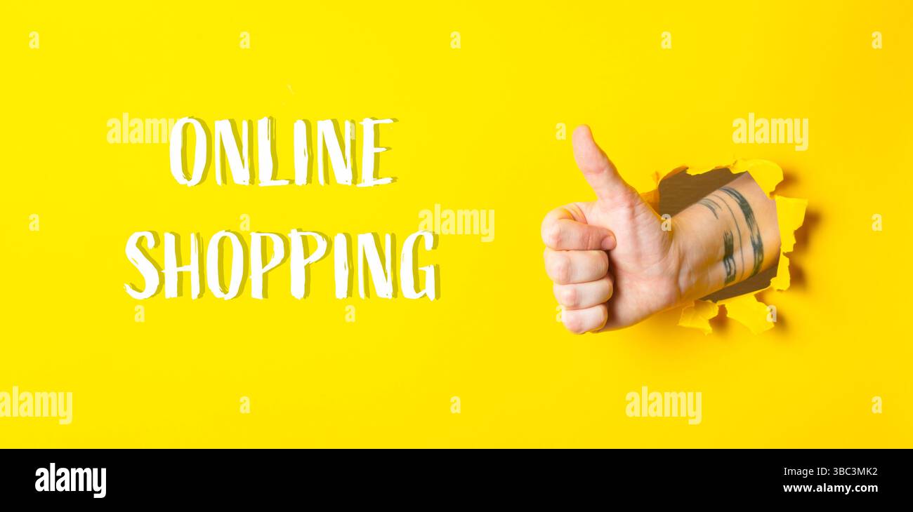 Hand is shown with a thumbs up sign in front of a yellow background ...