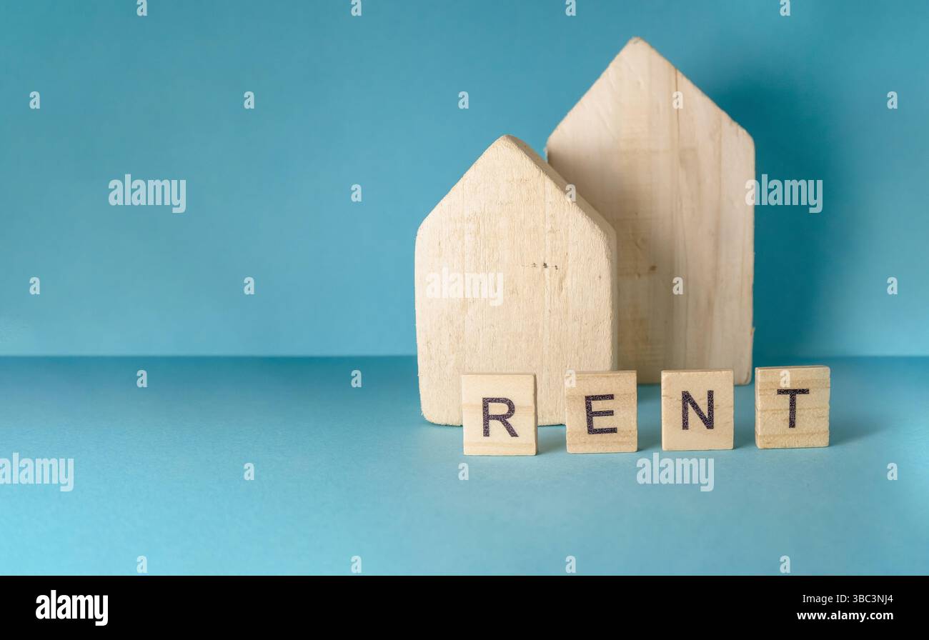 Wooden house with the word rent written on it. The letters are in a ...