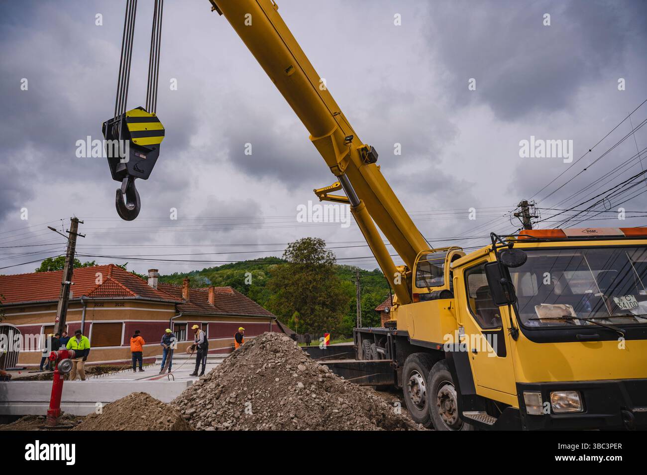 Orastioara de Sus, Romania - May 12, 2025: Yellow Mobile Crane on a ...