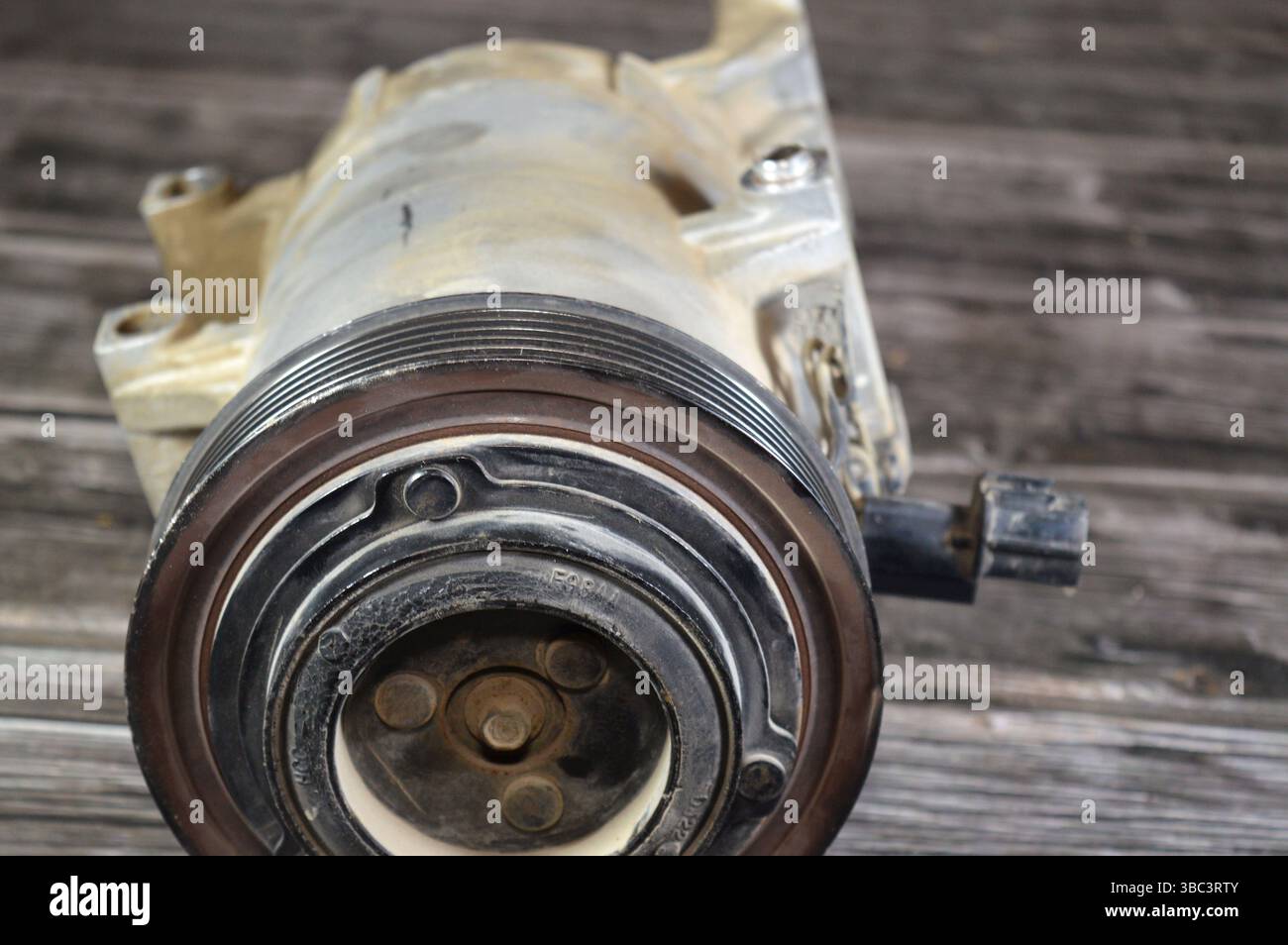 Maintenance of an old dusty car air conditioner compressor, the power ...