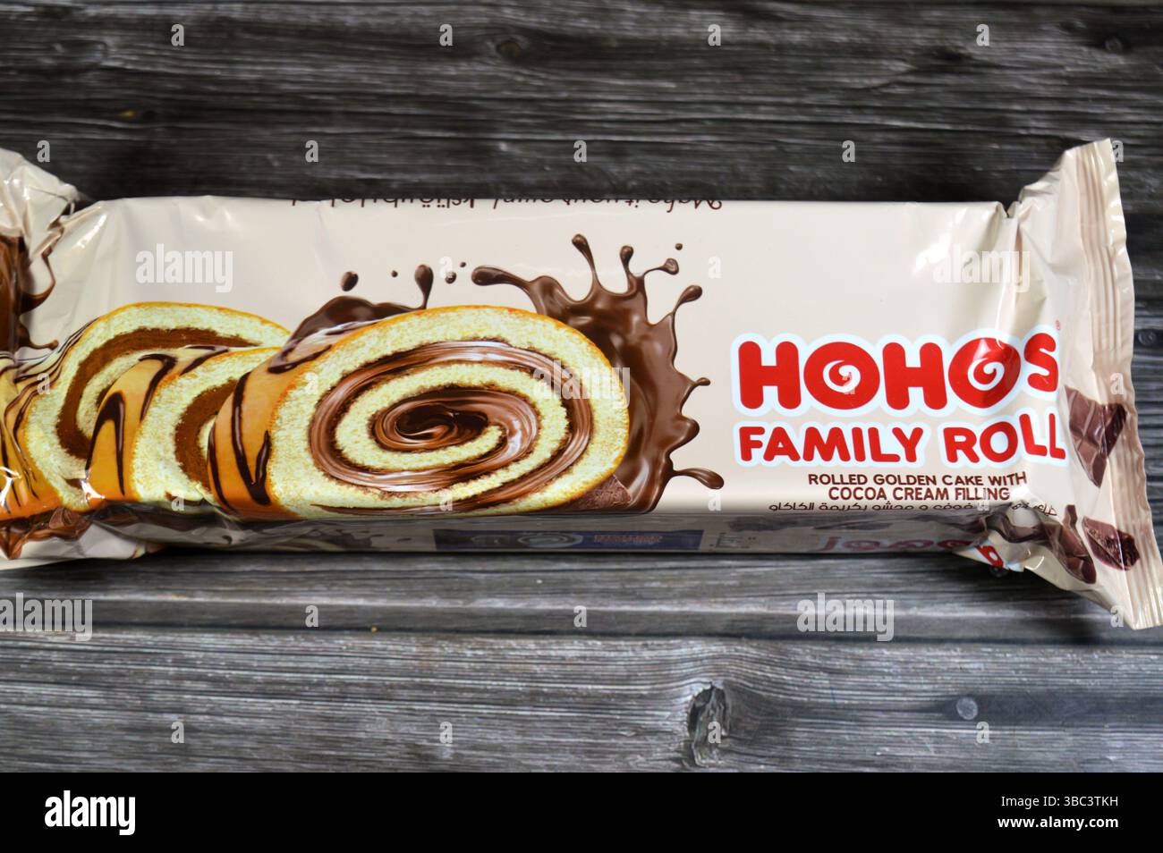 Cairo, Egypt, May 10 2025: Rolled golden cake with cocoa cream filling HOHOS by Edita food ...
