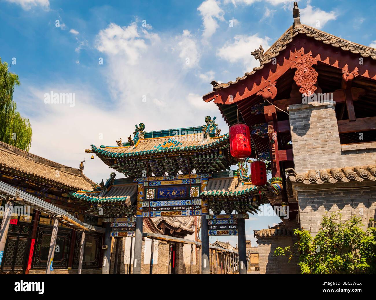 Colorful city wall gate leading to the entrance of Confucius temple ...