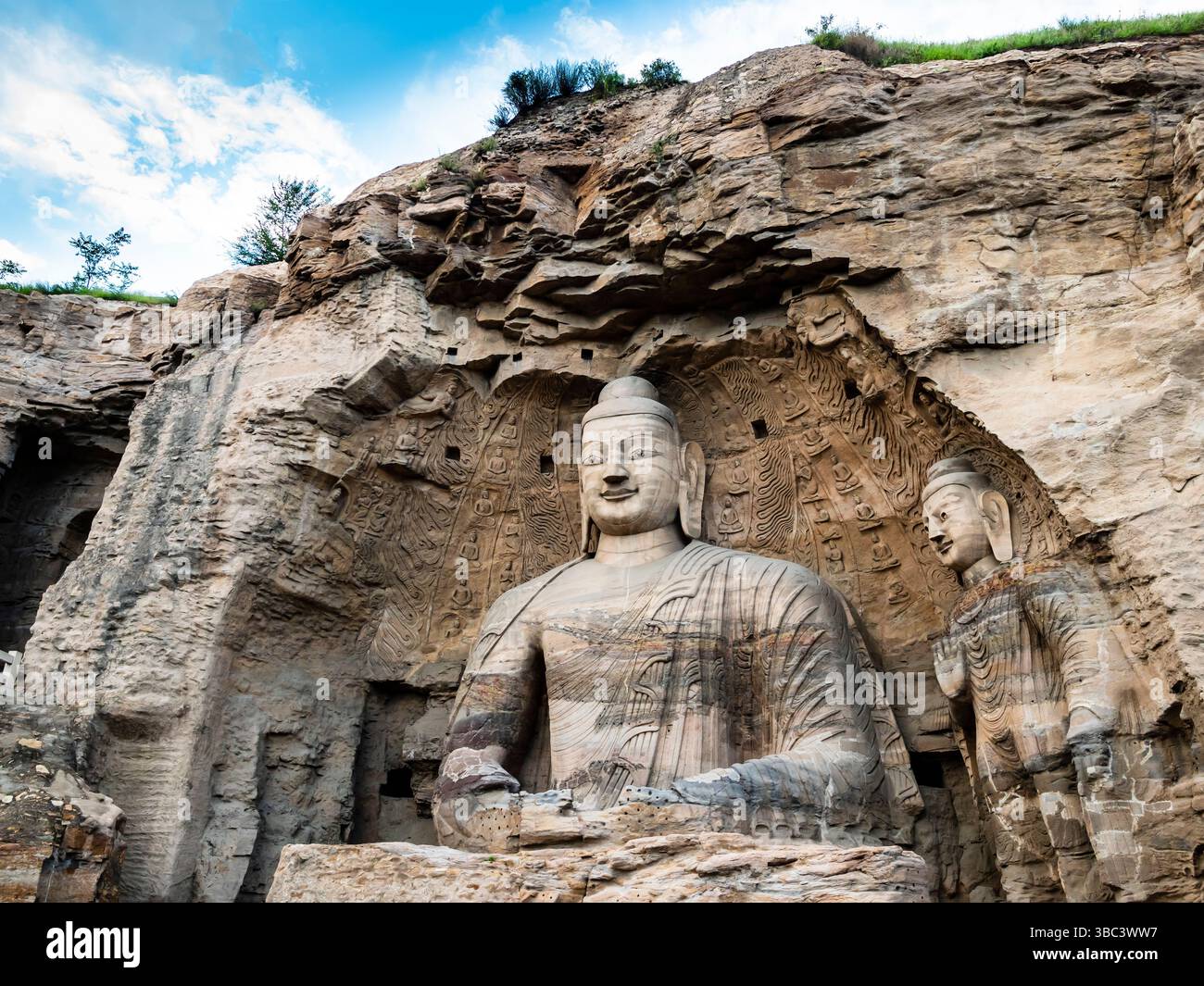 Impressive giant Buddha in Yungang grottoes, ancient buddhist temple in ...
