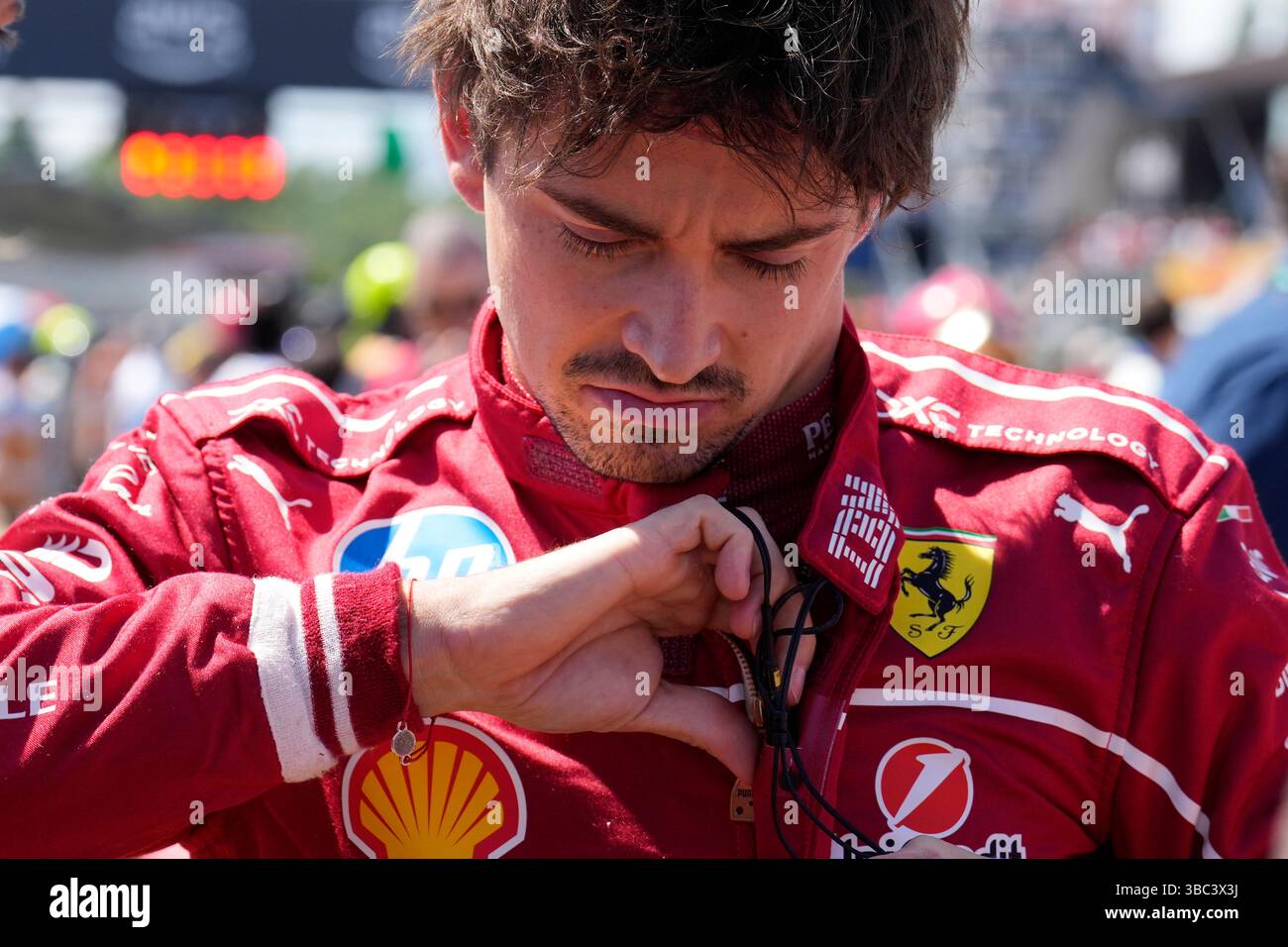 Ferrari driver Charles Leclerc of Monaco is on the starting grid before ...